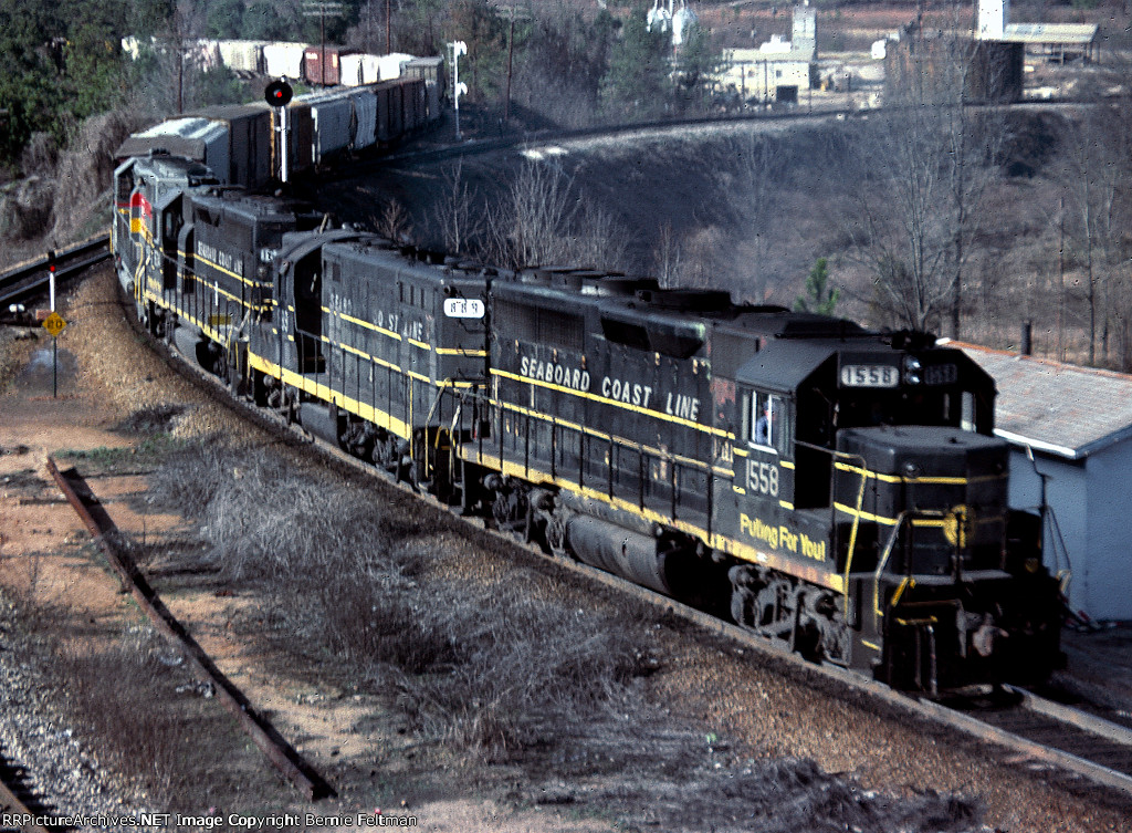 Seaboard Coast Line GP40 #1558, GP7 #889, GP40-2 #1634 & SD40-2 #8040 lead train #307 off the ...